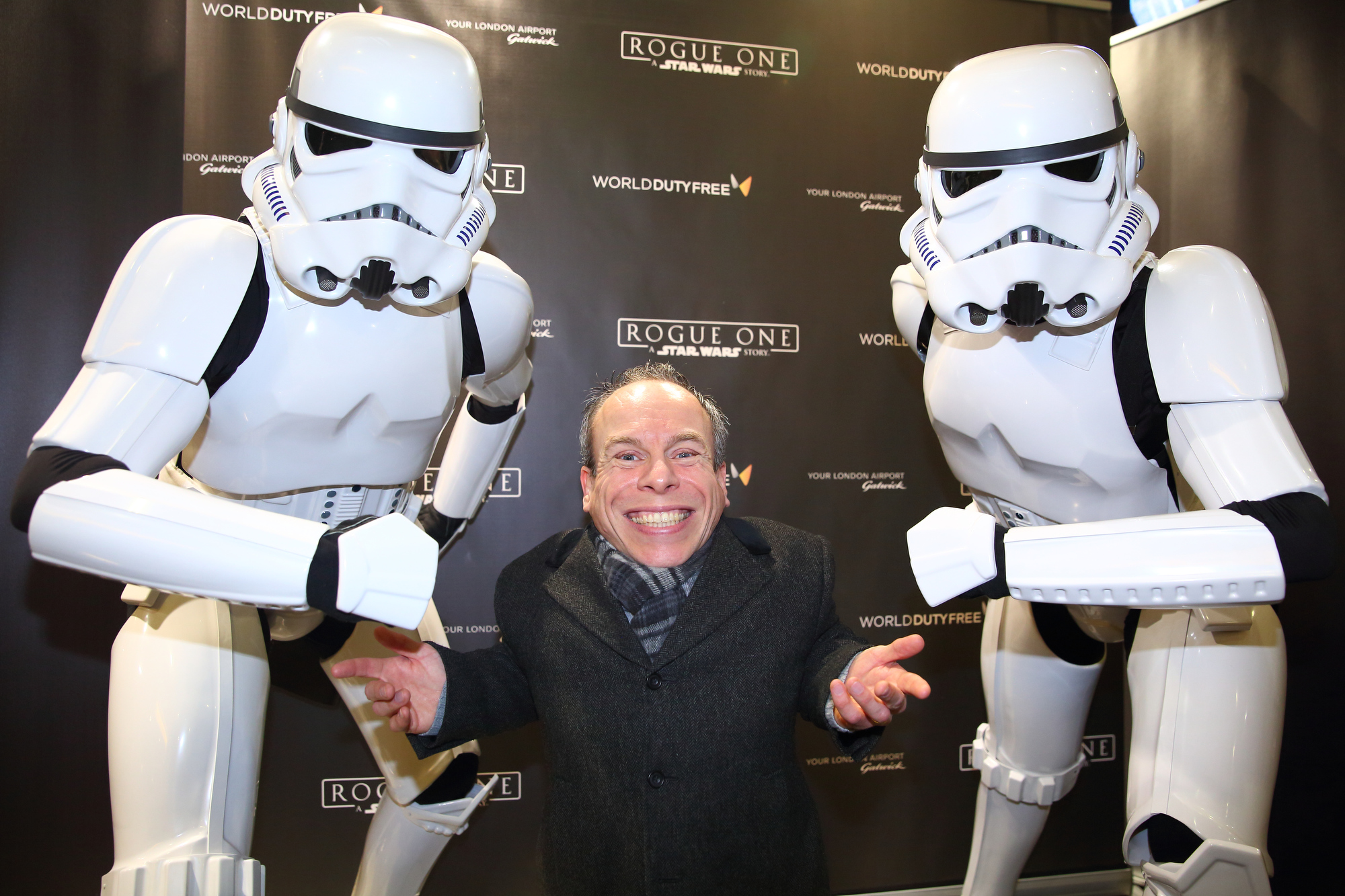Warwick Davis, guarded by Stormtroopers at World Duty Free Gatwick to ...